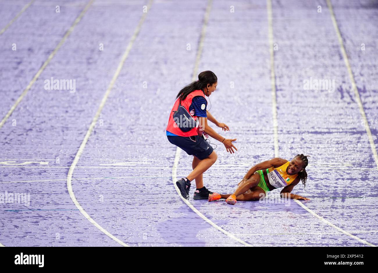 Marie Josée Ta Lou-Smith of the Ivory Coast lies injured following the ...