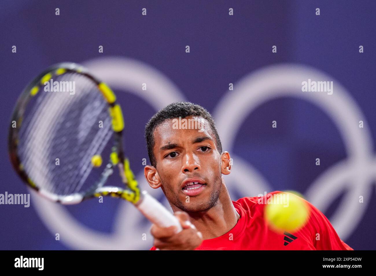 Felix Auger-Aliassime of Canada returns the ball against Lorenzo Musetti of Italy during men's ...