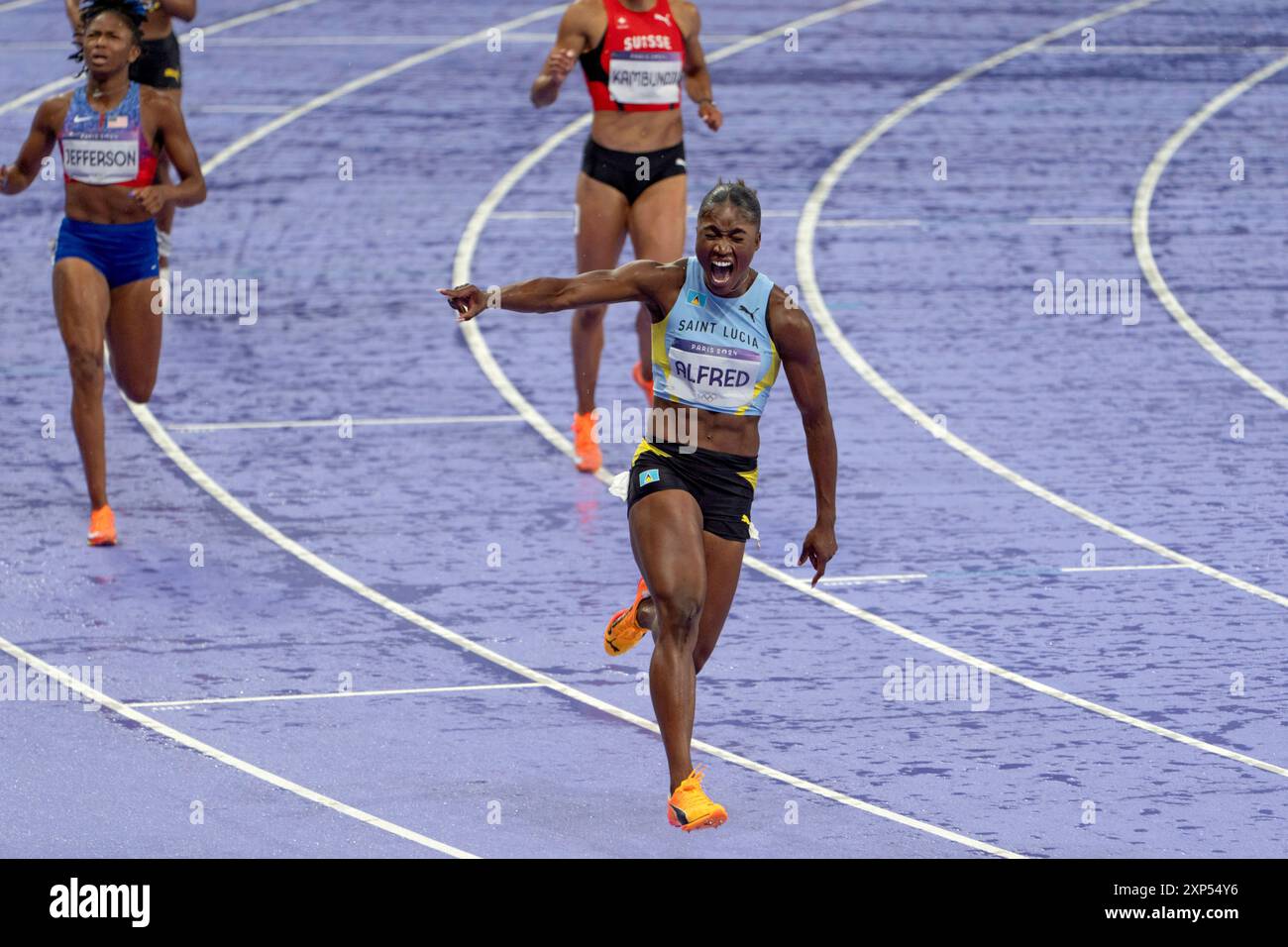 Julien Alfred, of Saint Lucia, celebrates after winning the women's 100 ...
