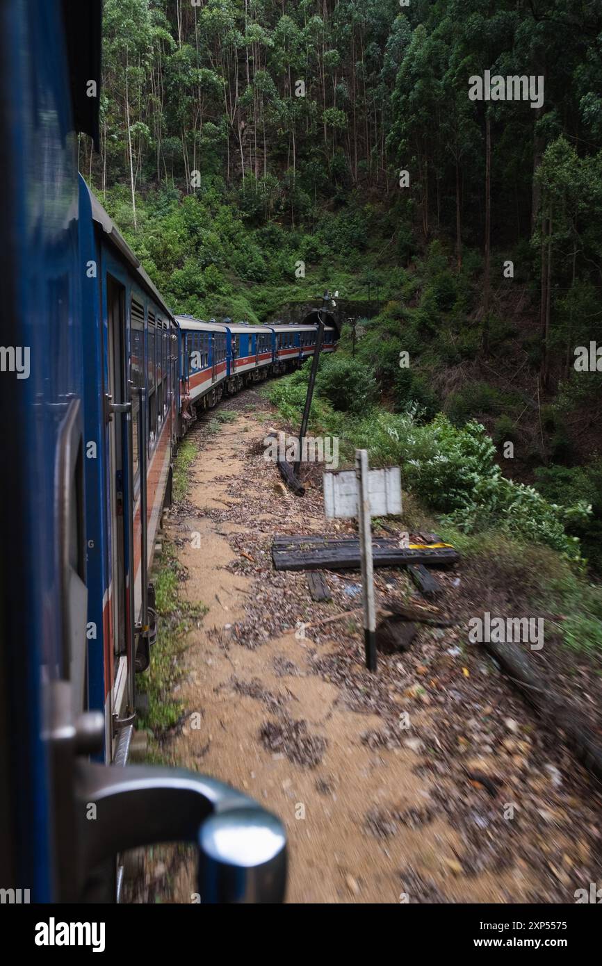 Blue train from Ella to Kandy going into a tunnel in Sri Lanka Stock ...