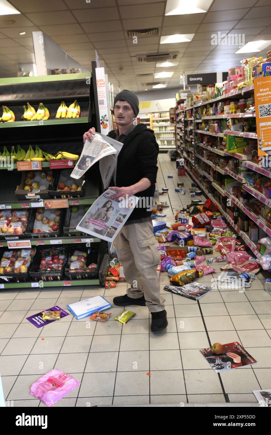 Manchester, England, UK. 3rd Aug, 2024. A shop is tidied after ...