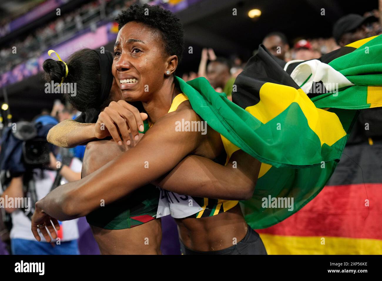 Silver medalist Shanieka Ricketts, right, of Jamaica, hugs gold ...