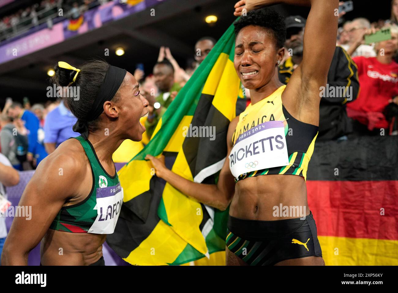 Silver medalist Shanieka Ricketts, right, of Jamaica, reacts with gold ...