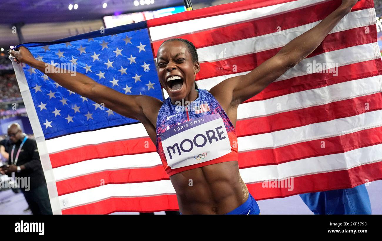 Jasmine Moore, of the United States, reacts after winning the bronze ...