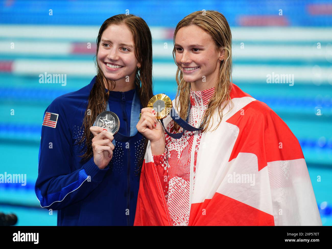 Canada's Summer McIntosh (right) with the gold medal after winning the Women's 200m Individual ...
