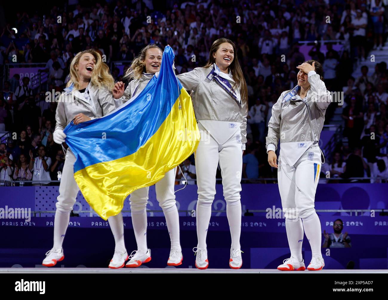 Paris, France. 3rd Aug, 2024. Team Ukraine celebrate victory after the ...