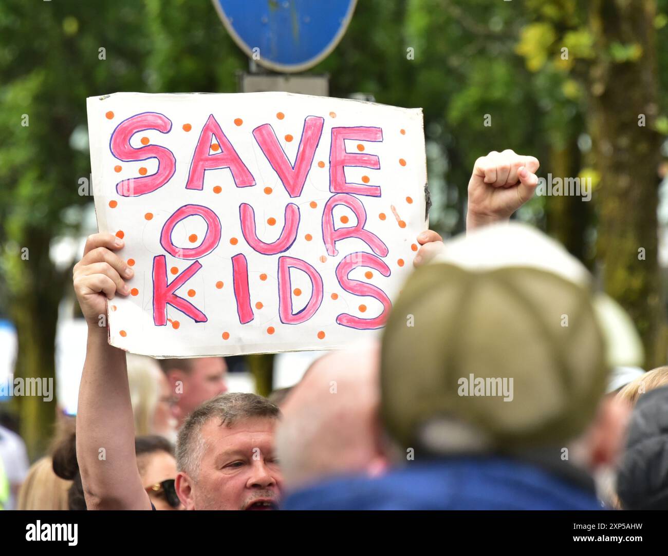 Manchester, UK, 3rd August, 2024. Man holds 'save our kids' placard ...