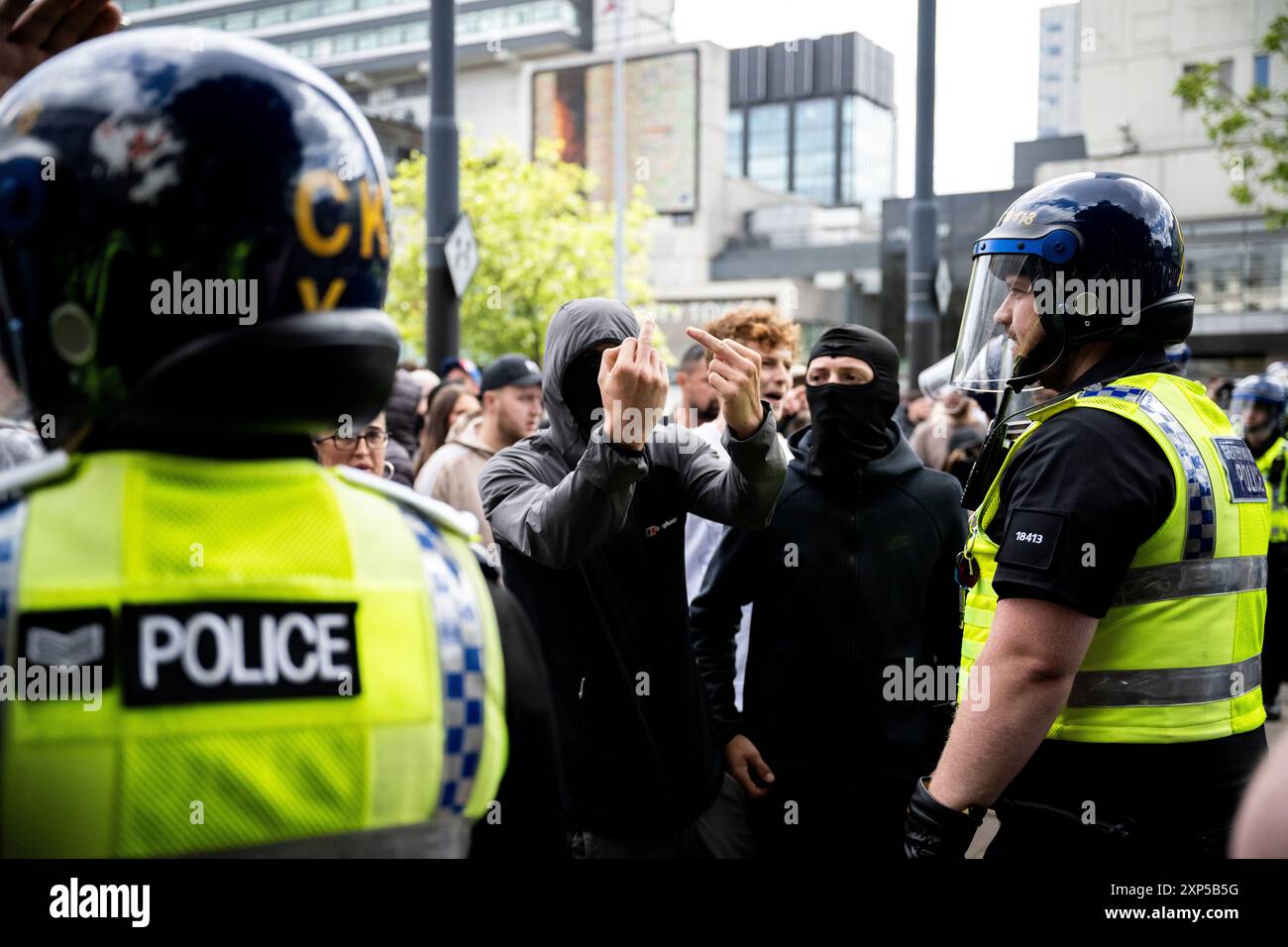 Manchester, 3 August 2024. Protestors clash with police and counter ...