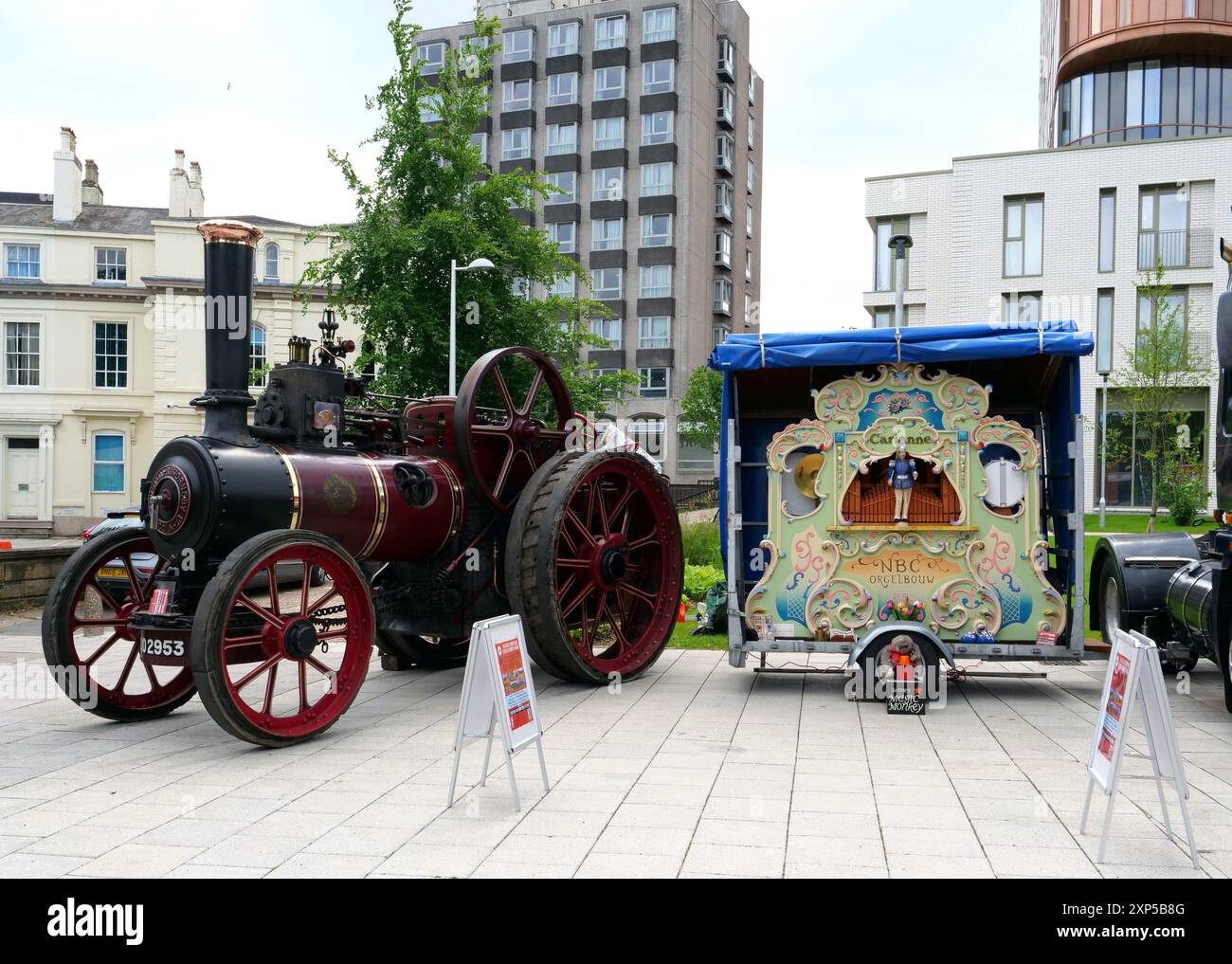 A photograph that depicts fairground equipment such as Traction engine ...