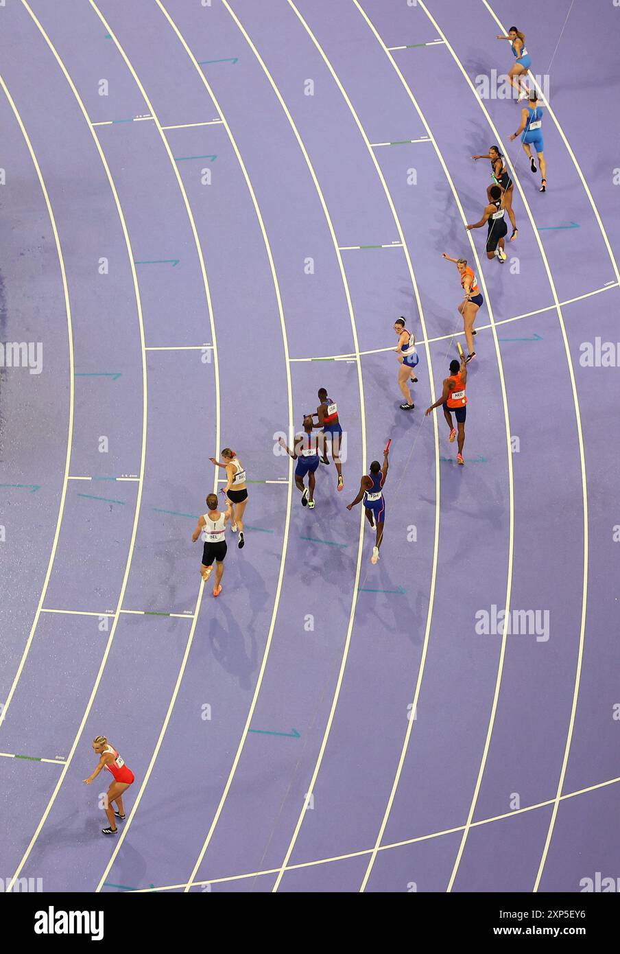 Paris, France. 3rd Aug, 2024. Athletes compete during the 4x400m relay ...