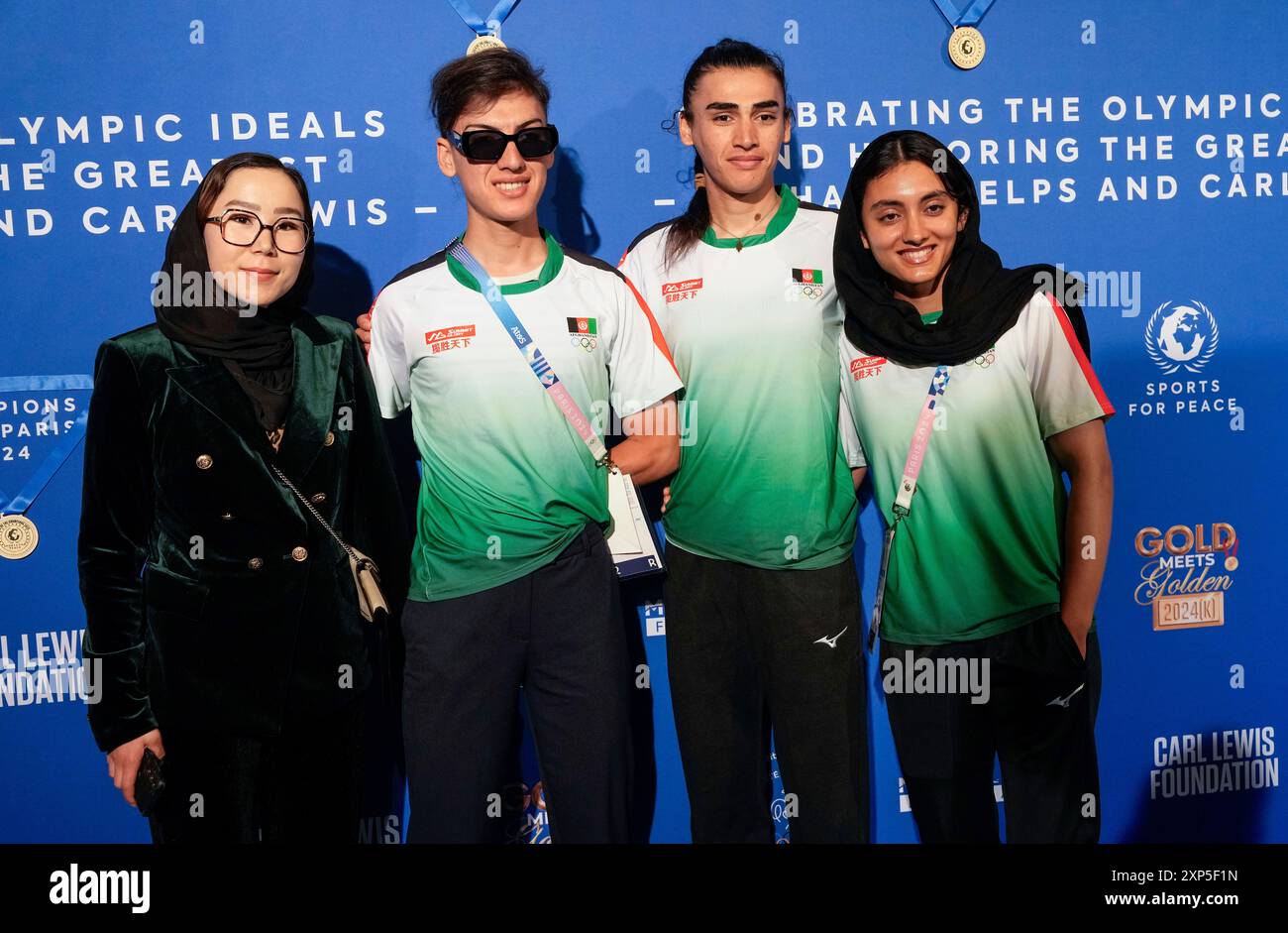 Afghanistan athletes from left to right, Zakia Khudadi, Fariba Hahimi ...
