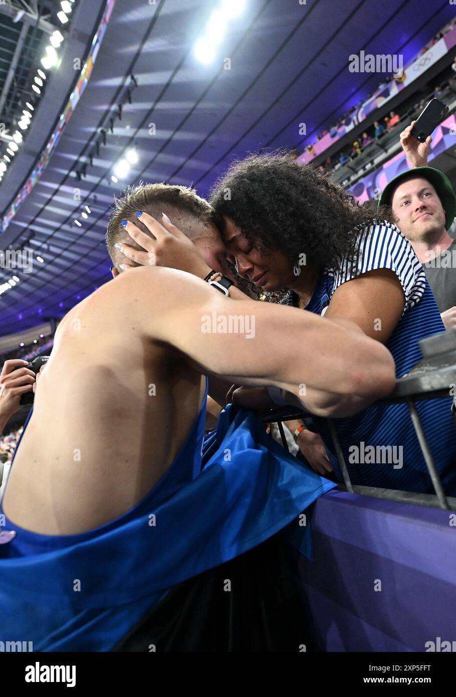 Paris, France. 3rd Aug, 2024. Janek Oiglane (L) of Estonia reacts after the men's decathlon of ...