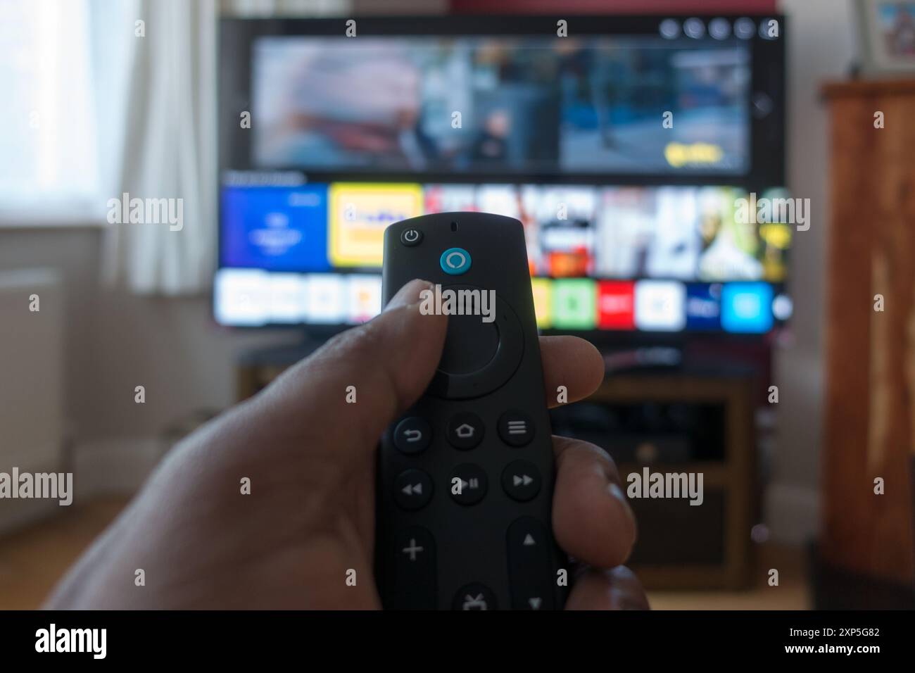 Tv remote alexa button hi-res stock photography and images - Alamy