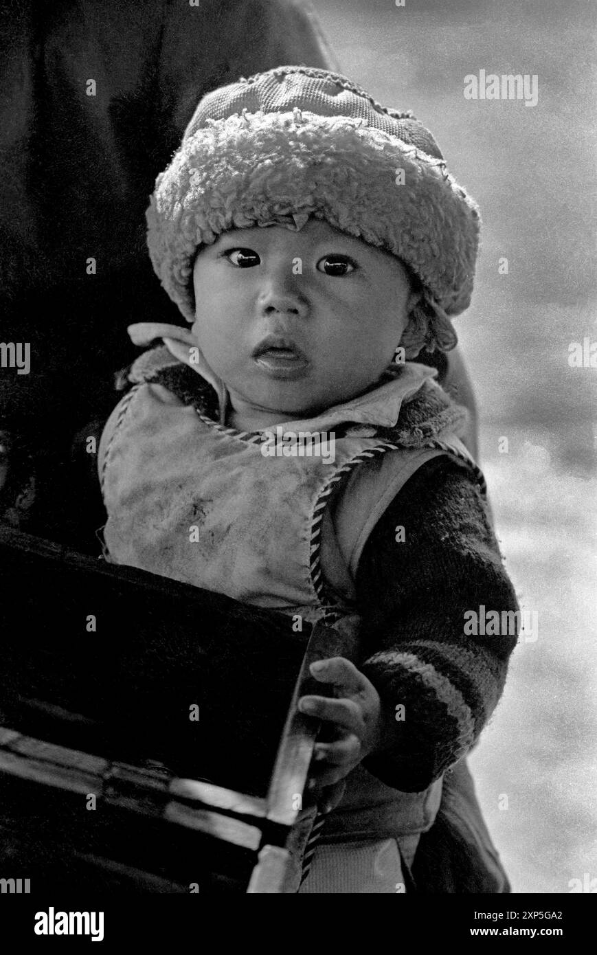 An ethnic tribal baby from the Yi tribe in the rural village of Dali ...