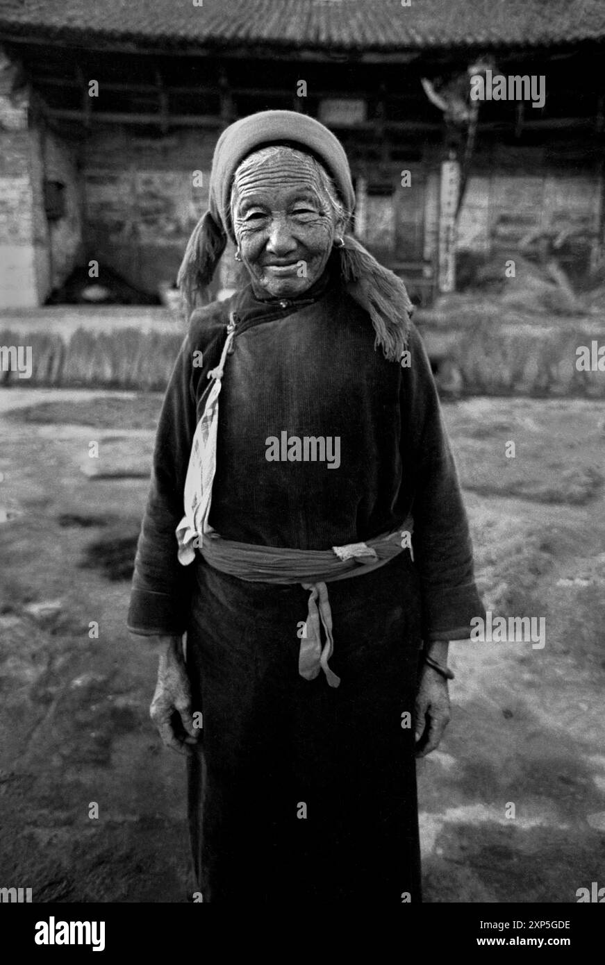 An elder from the Yi tribe at a temple in the rural village of Dali ...