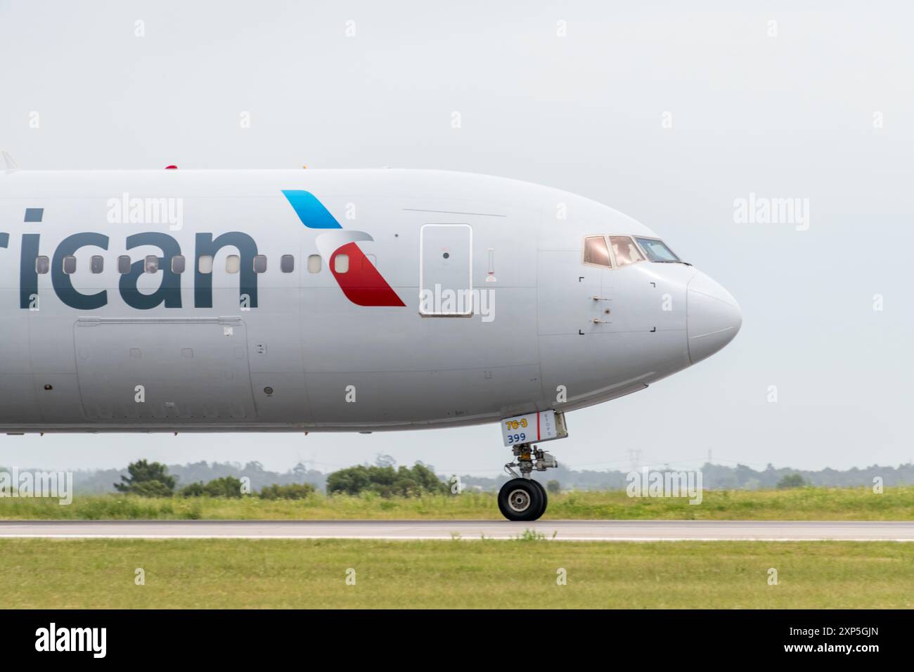 American Airlines aircraft taxiing on runway at an airport Stock Photo ...