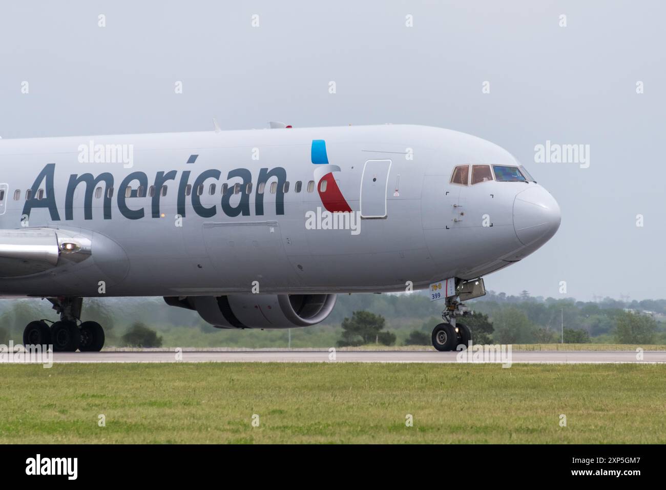 An American Airlines aircraft taxiing on a runway Stock Photo - Alamy