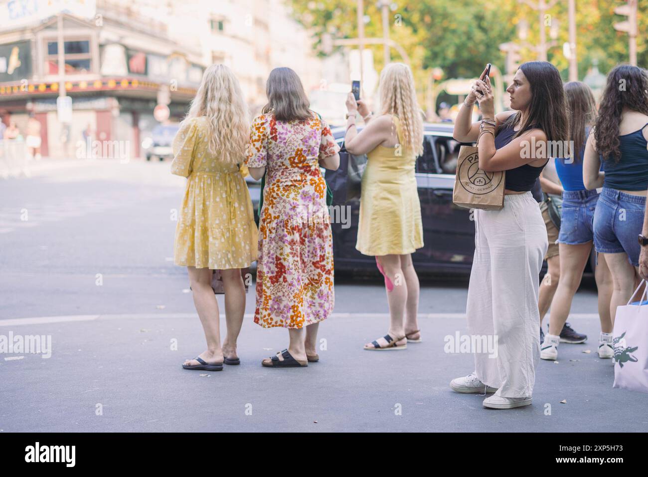 PARIS, FRANCE, 23.7.2024: Random people enjoying time and photographing ...