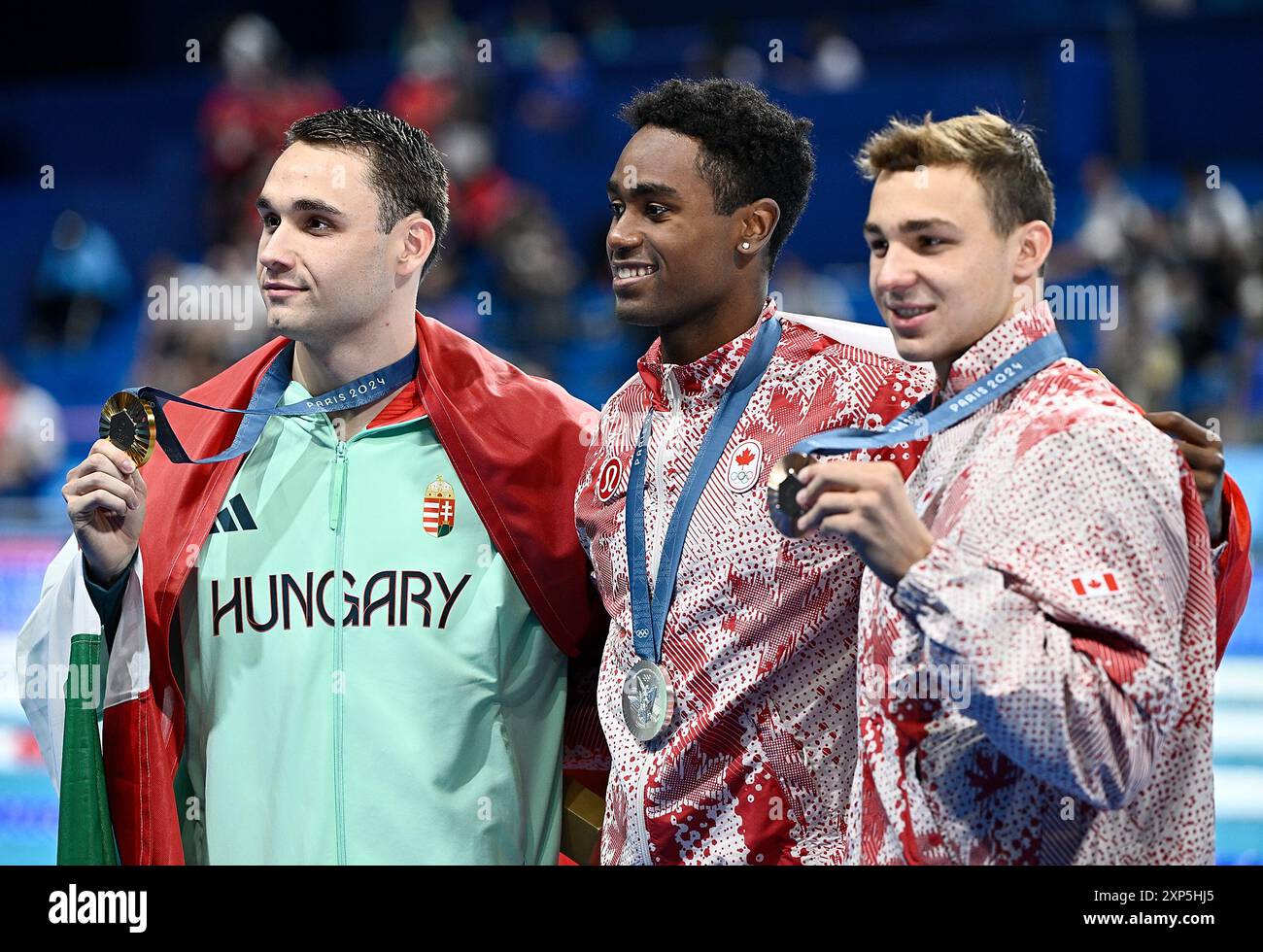 Paris, France. 3rd Aug, 2024. Gold medalist Kristof Milak (C) of ...