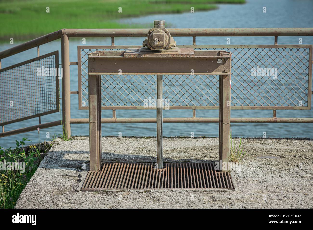 Water valve on a dam with water, to set the overflow value for the ...