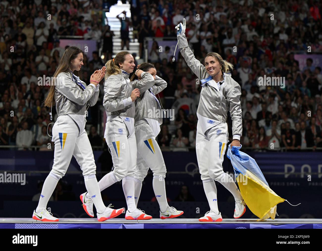 Ukraine's team members react after winning the gold medal in the women ...