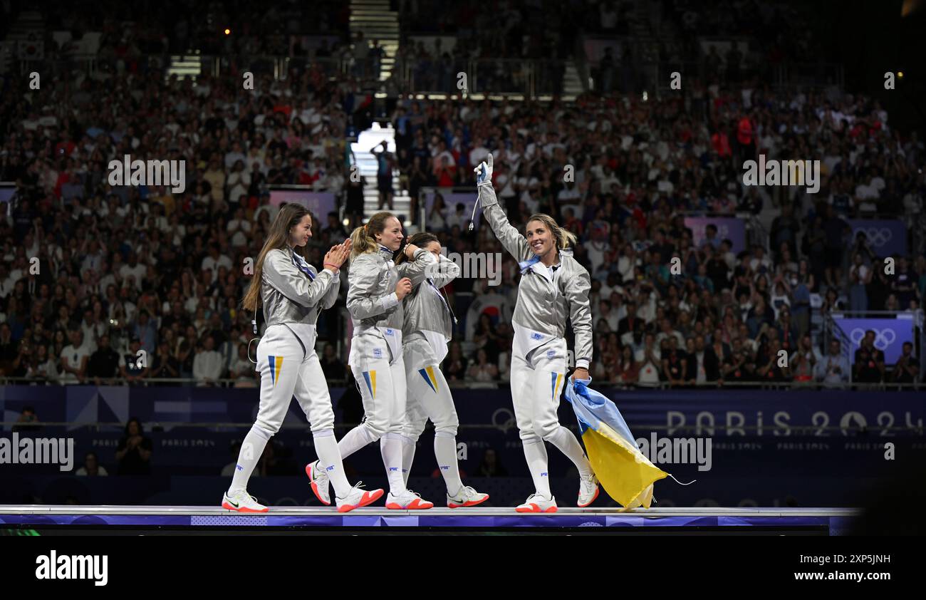 Ukraine's team members react after winning the gold medal in the women ...