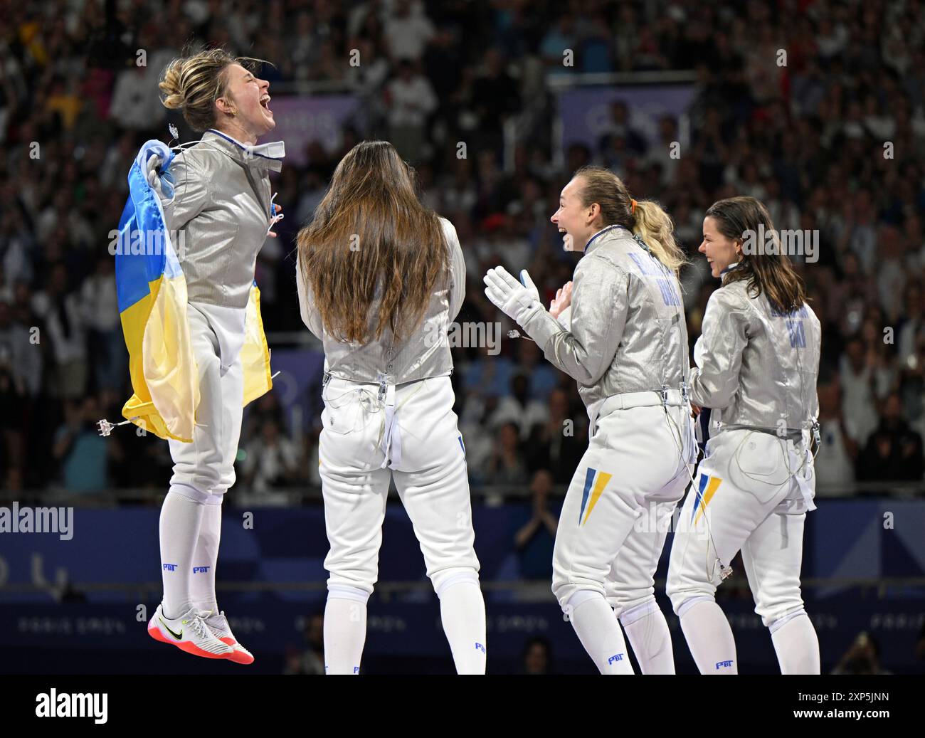 Ukraine's team members react after winning the gold medal in the women ...