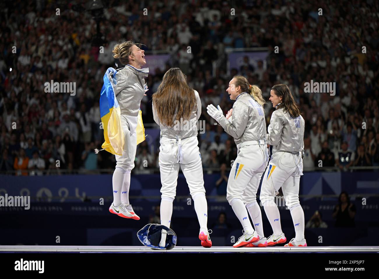 Ukraine's team members react after winning the gold medal in the women ...