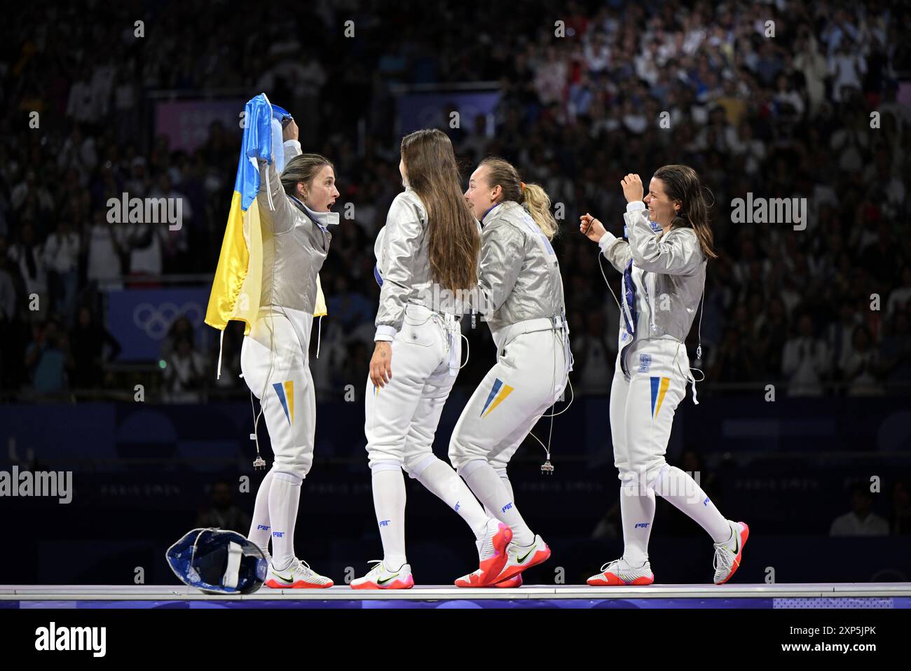 Ukraine's team members react after winning the gold medal in the women ...