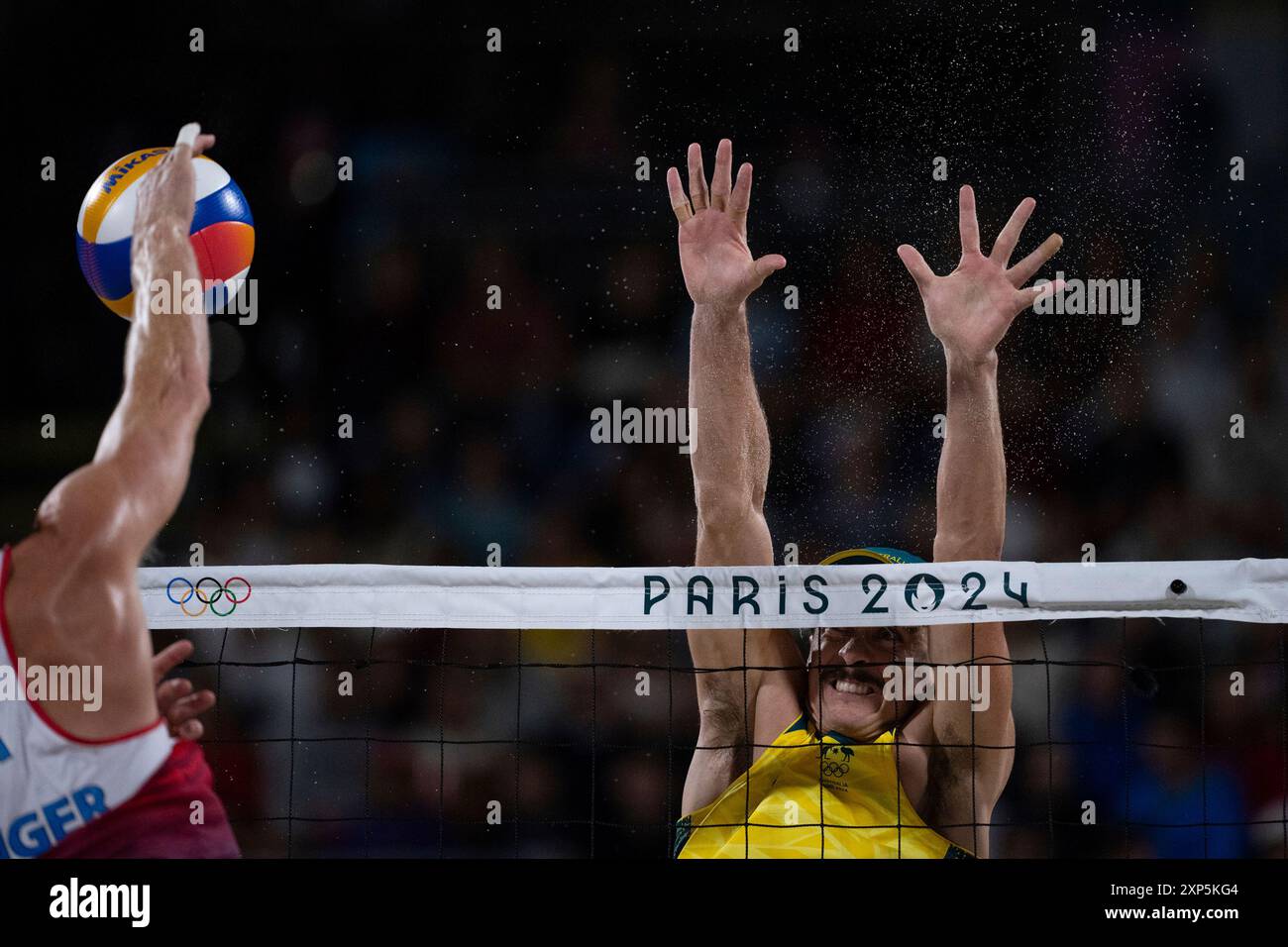 Australia's Thomas Hodges defends during the men's lucky loser beach ...