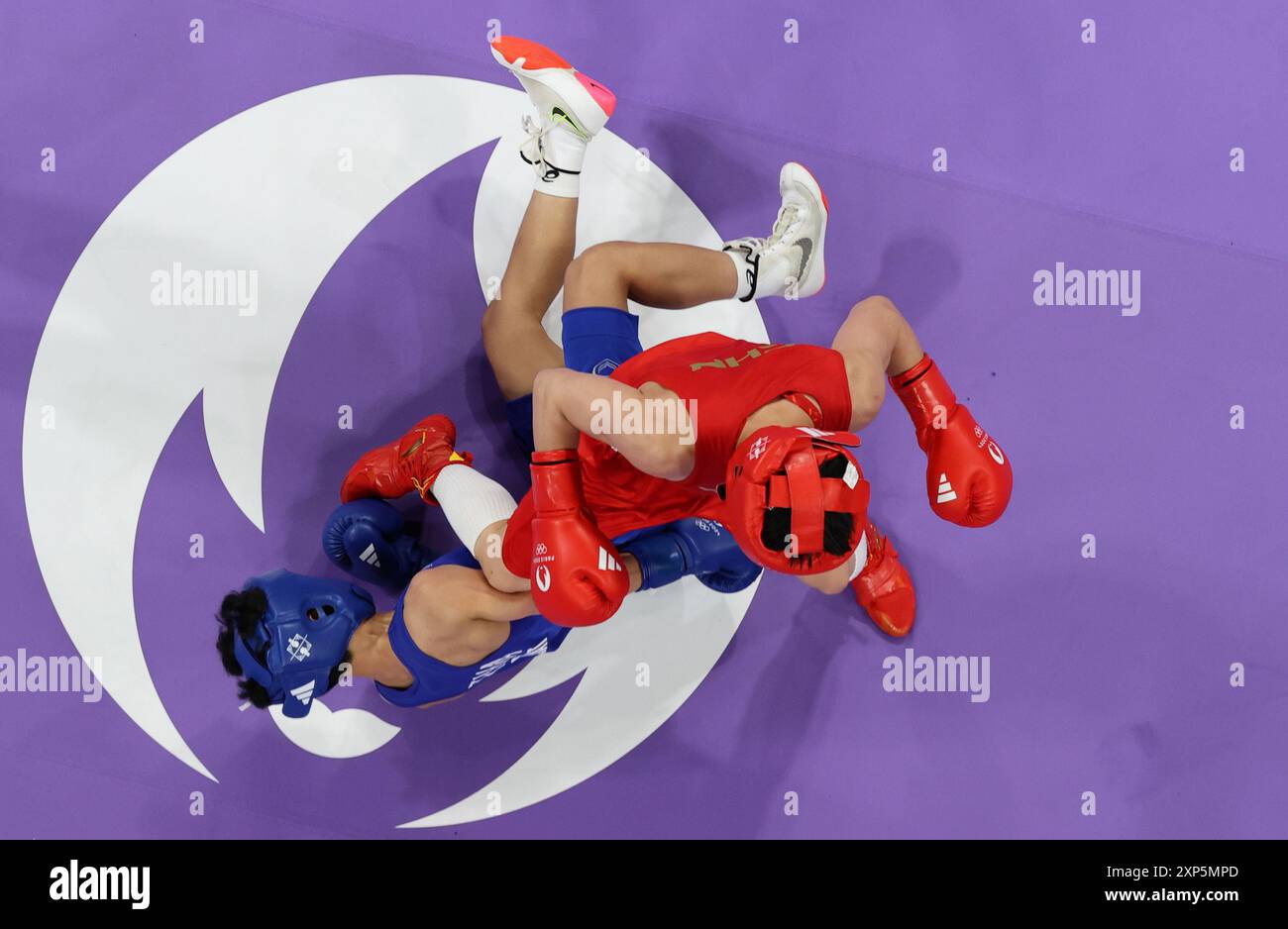 Paris, France. 3rd Aug, 2024. Wu Yu (R) of China competes against ...