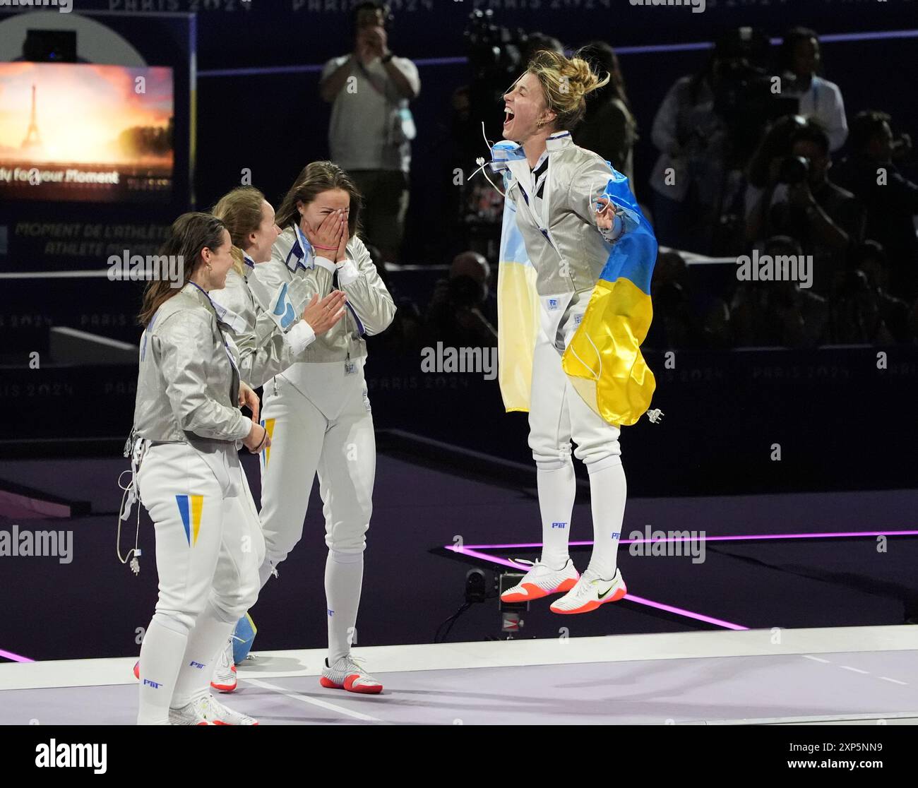 Members of Ukraine celebrate after winning the gold medal in the women ...