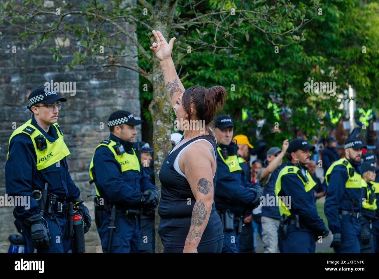 Bristol, UK. 3rd Aug, 2024. An Enough is enough protester is pictured ...