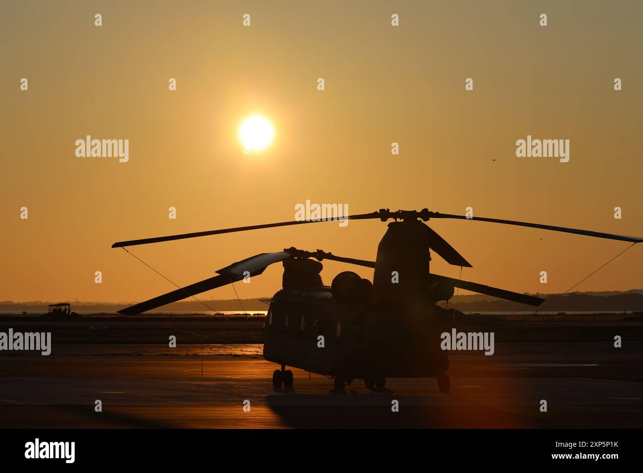 An Army National Guard CH-47 helicopter sits on the tarmac at Quonset ...