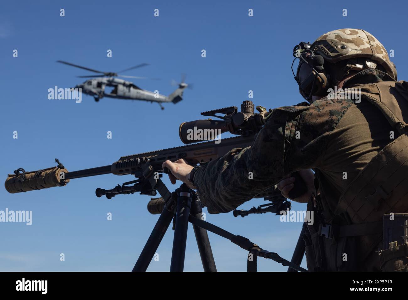 U.S. Marine Corps Sgt. Adam Scherrer, a scout sniper with Battalion Landing Team 1/4, 31st ...
