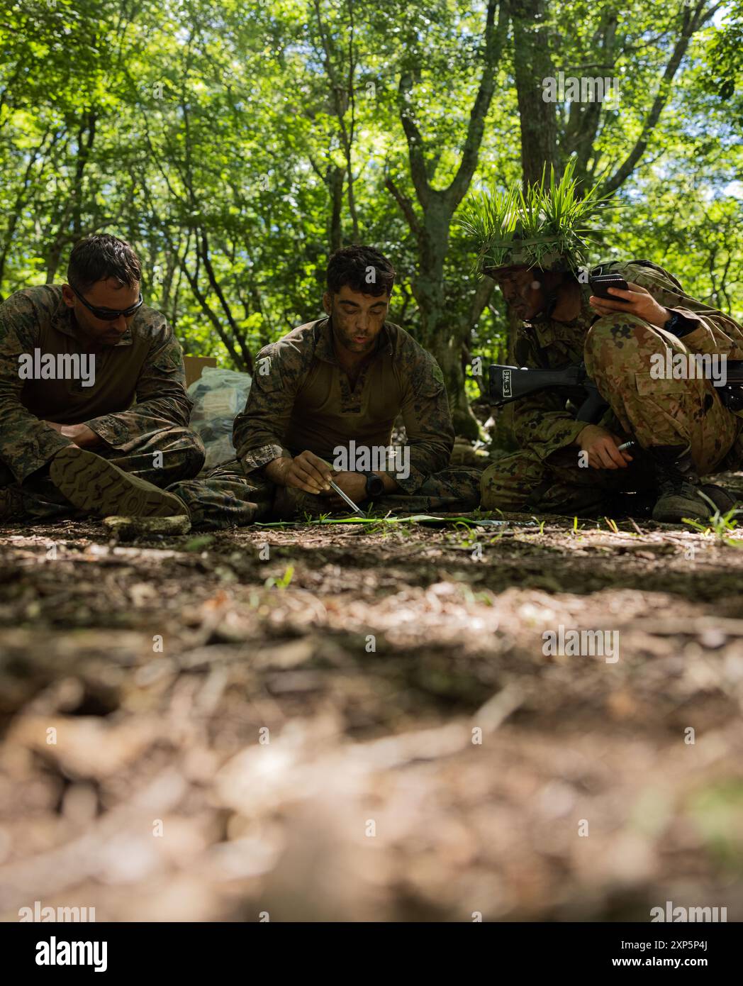 U.S. Marines and a Japan Ground Self-Defense Force member plan their ...