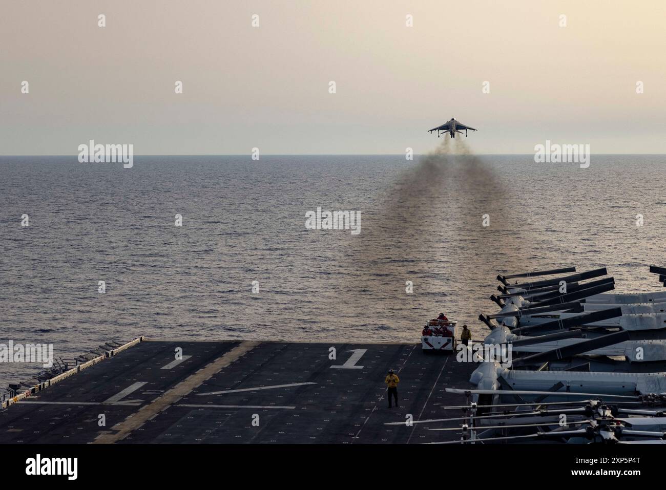 A U.S. Marine Corps AV-8B Harrier jet with Marine Medium Tiltrotor ...