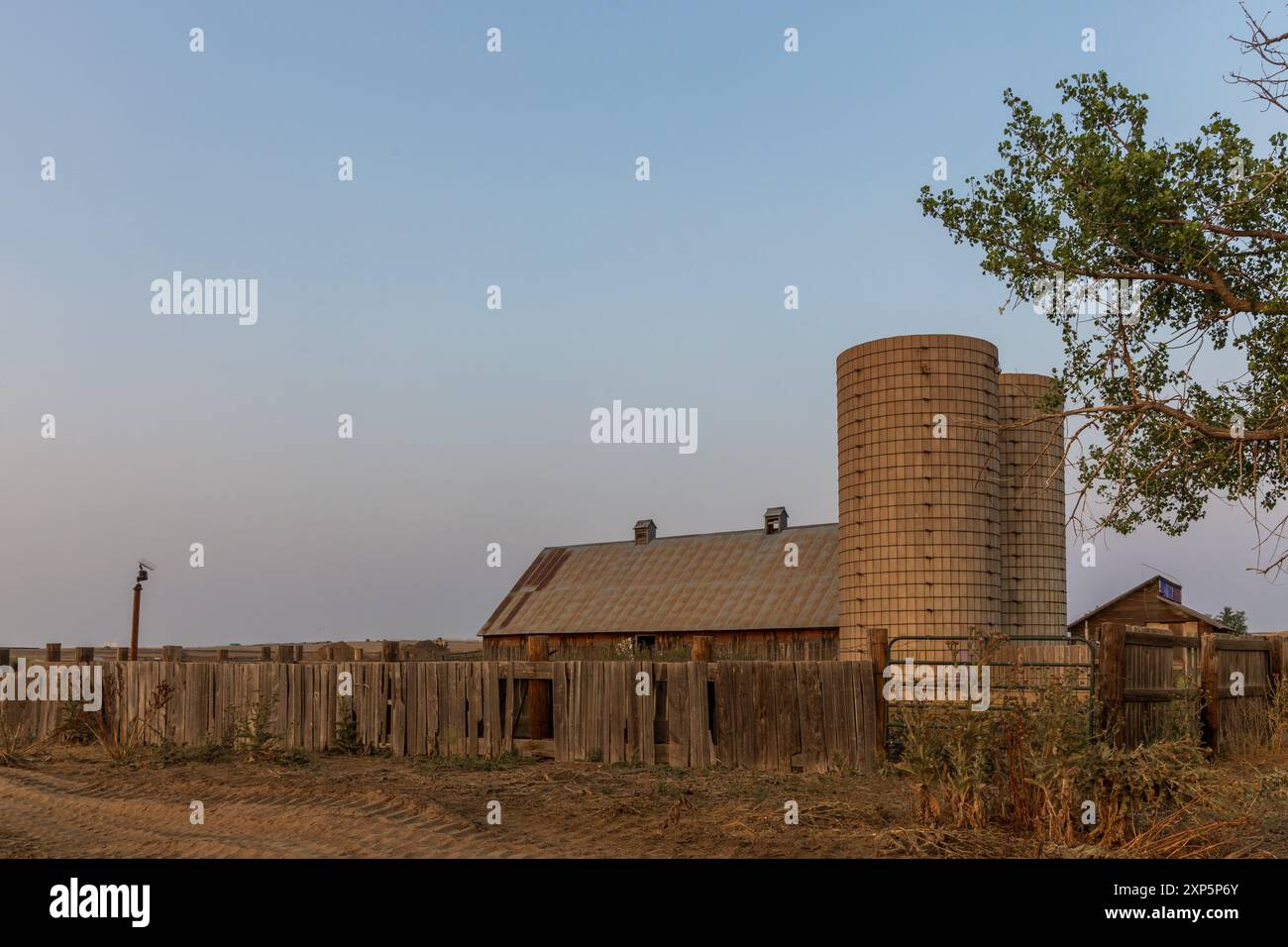 Abandoned farm ruins with barns and agriculture equipment in the ...