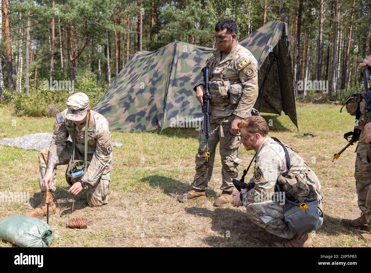 U.S. Soldiers, assigned to V Corps, receive instruction on an explosive ...