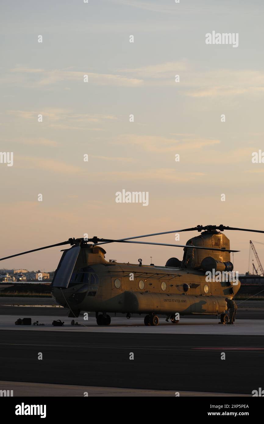 An Army National Guard CH-47 helicopter sits on the tarmac at Quonset ...