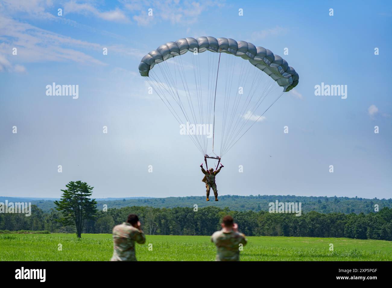 A U.S. Army free fall parachutist prepares for landing on the drop zone ...