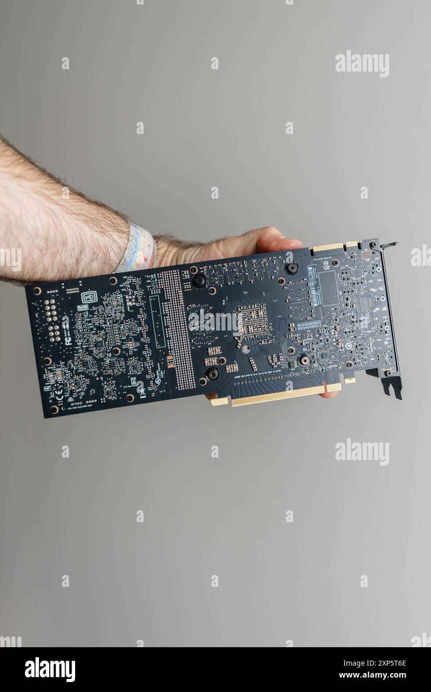 Paris, France - Apr 3, 2024: POV of a male hand holding an NVIDIA GPU ...