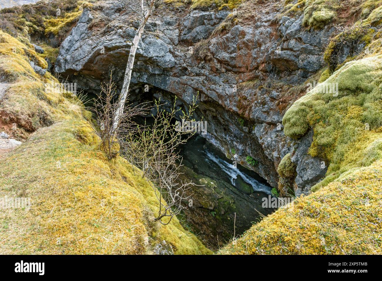 The lower entrance to the Uamh An Tartair (Cave of the Roaring), one of ...