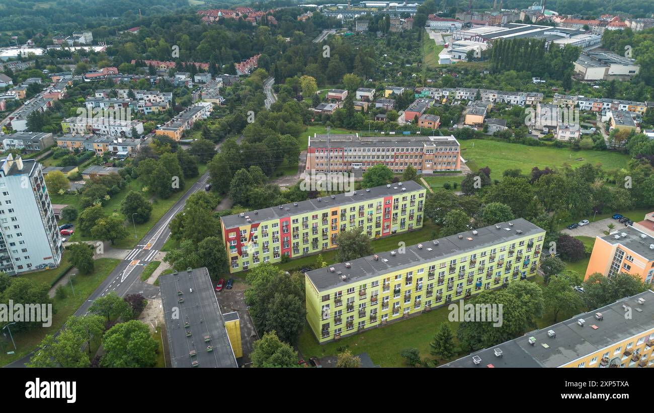 Aerial View of Colorful Apartment Buildings Surrounded by Greenery in a ...
