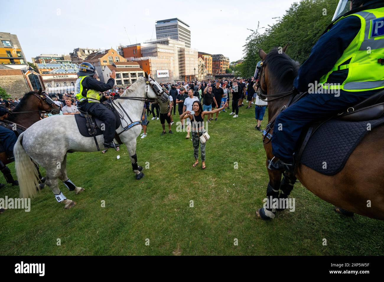 Protesters face-off against police and counter protesters during the ...