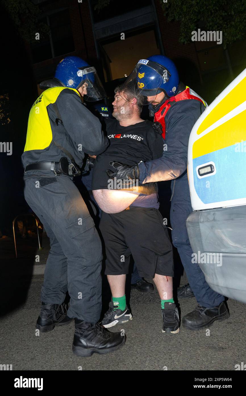 Protesters face-off against police and counter protesters during the ...