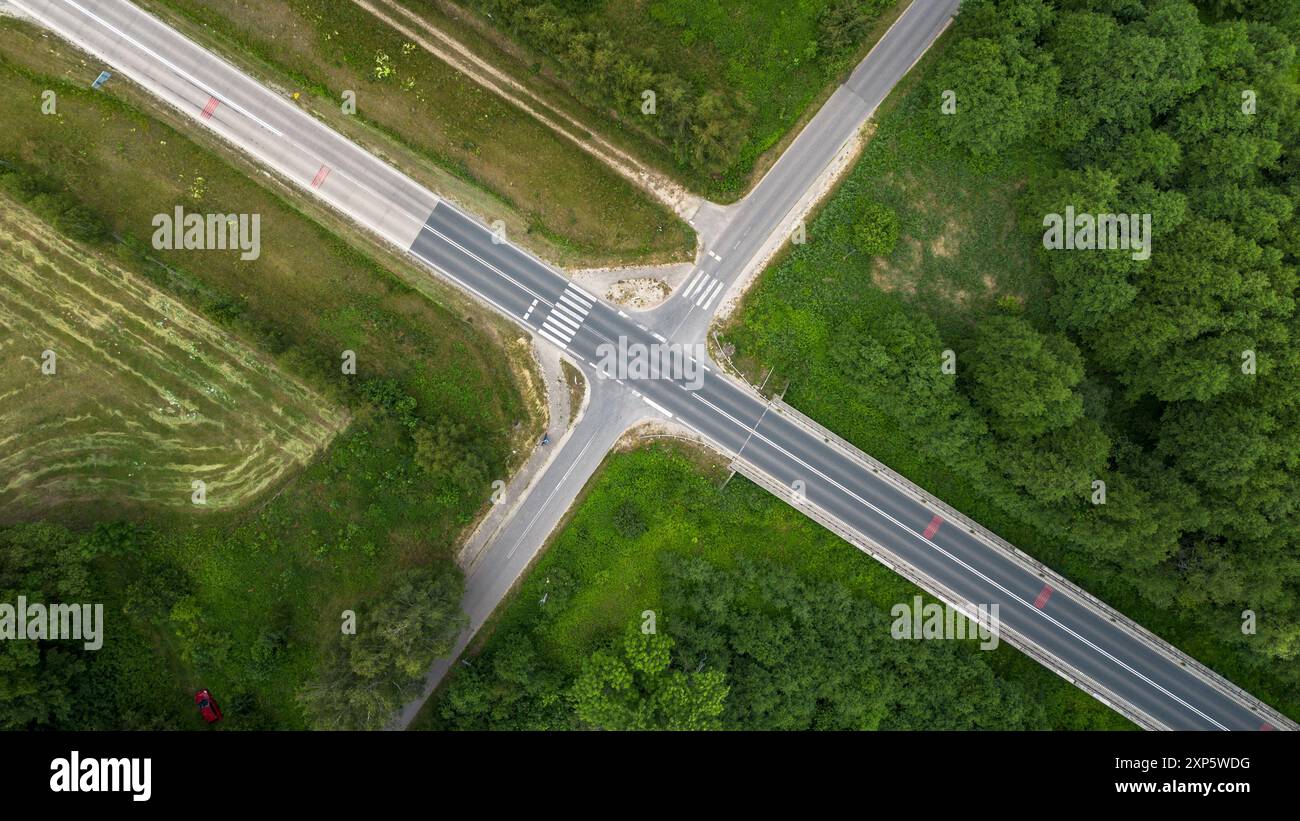 Overhead View of a Busy Crossroad Surrounded by Greenery During ...