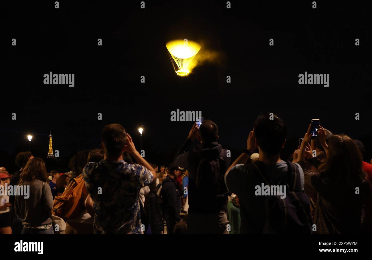 Paris, France. 03rd Aug, 2024. A large golden orb flies above the ...