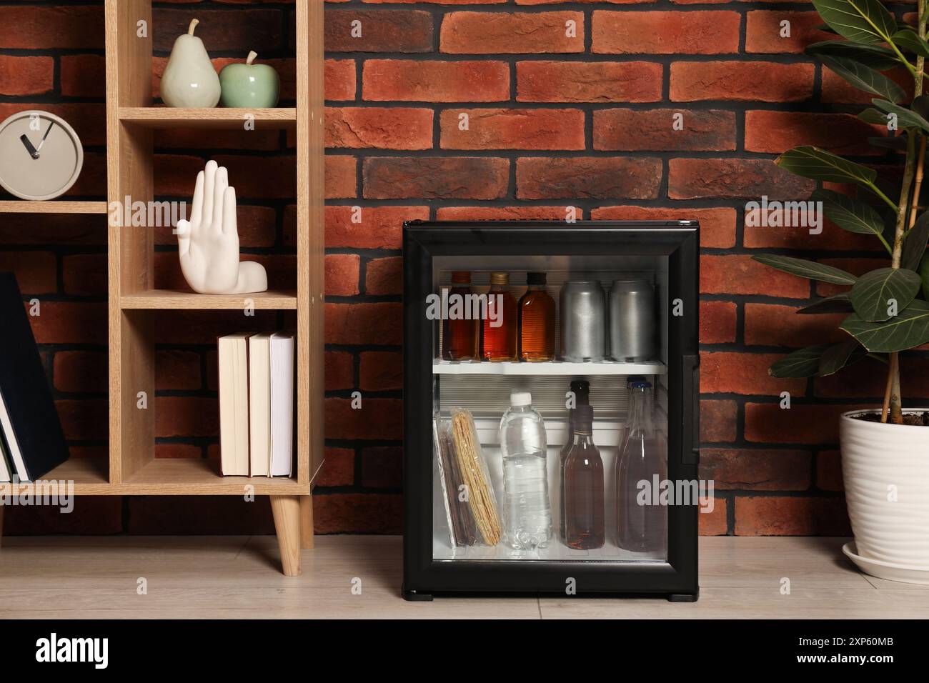 Mini refrigerator with drinks and snacks indoors Stock Photo - Alamy