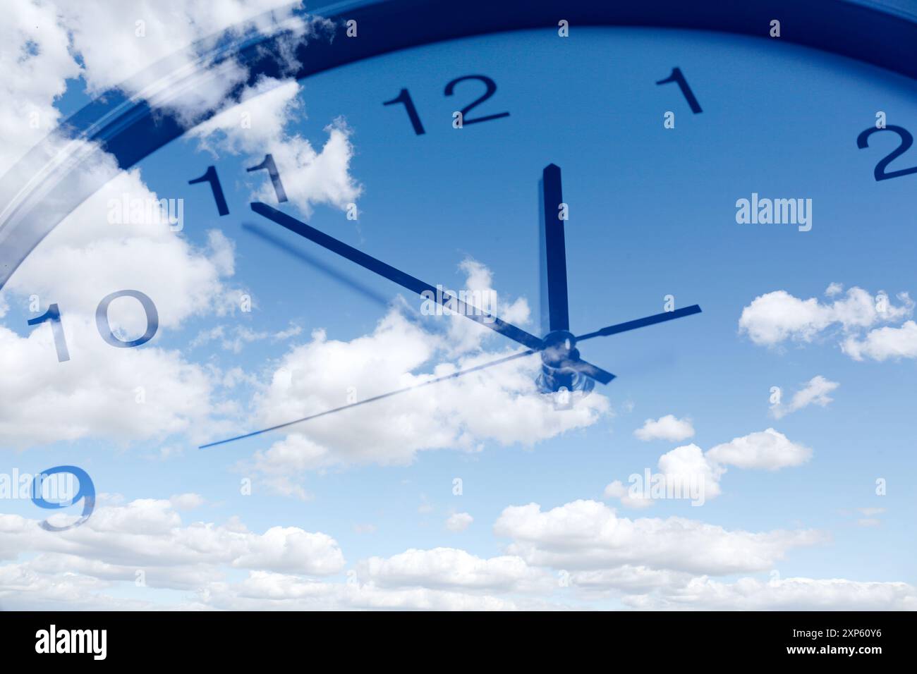 Time concept. Clock and blue sky with fluffy clouds, double exposure ...